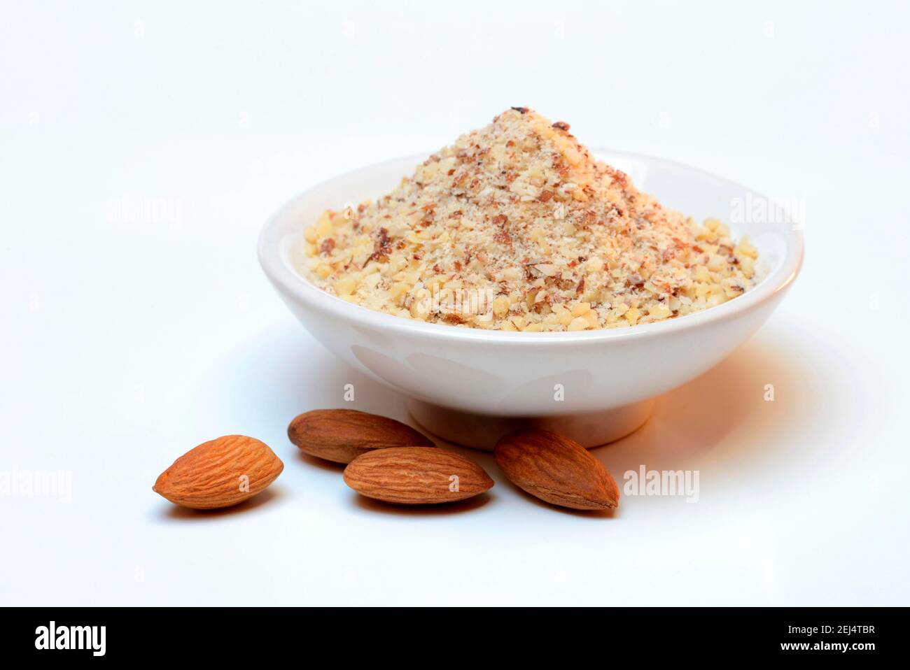 Ground almonds in shell and sweet almonds, almonds with skin ( Prunus ...