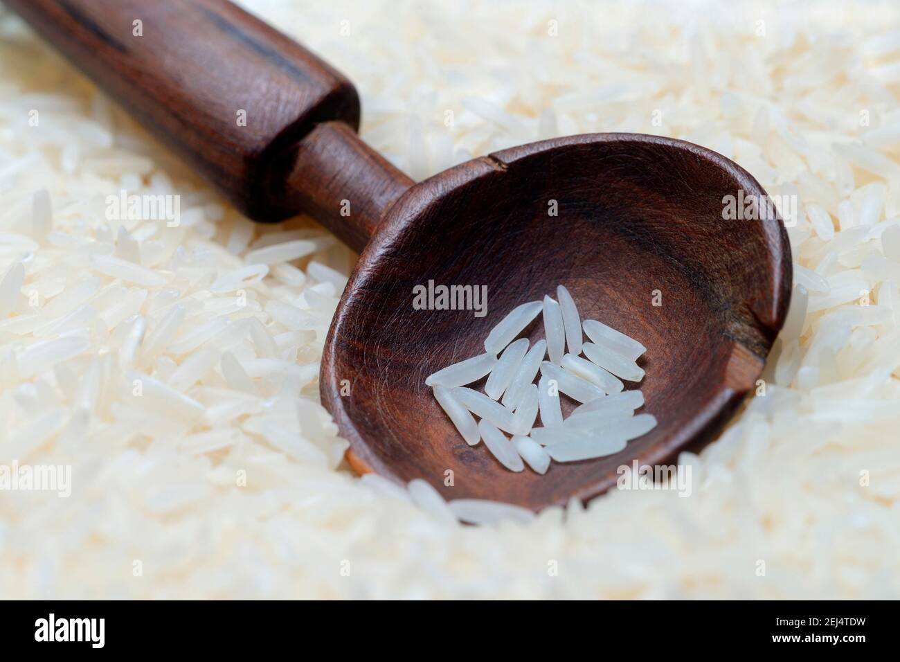 Basmati rice in wooden spoon Stock Photo - Alamy