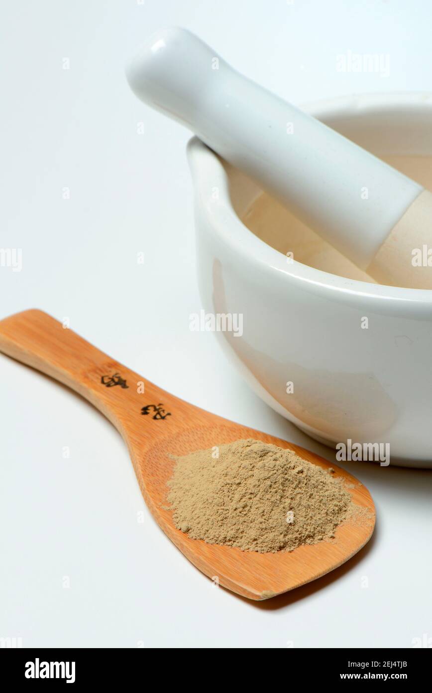 Healing earth powder with grating bowl, red clay Stock Photo - Alamy