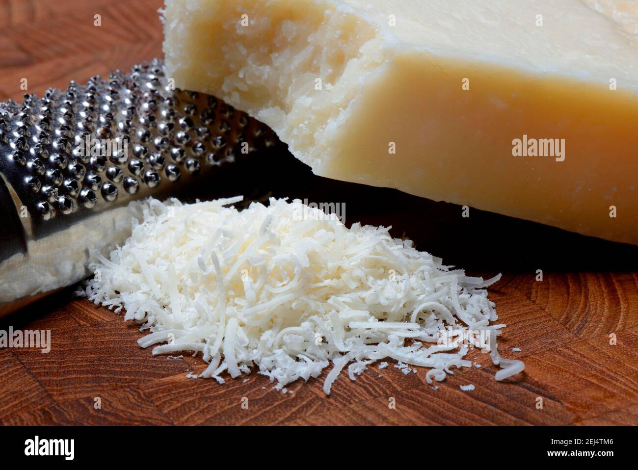 Grated Parmesan cheese and piece of Parmesan cheese, Parmigiano ...