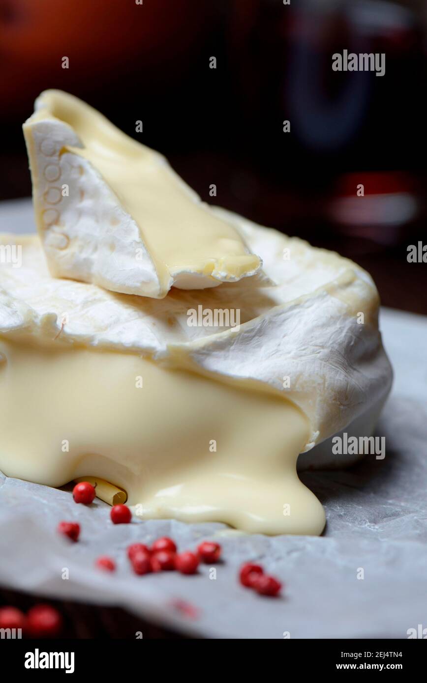 French soft cheese, Pave d'affinois, cut, sliced Stock Photo - Alamy