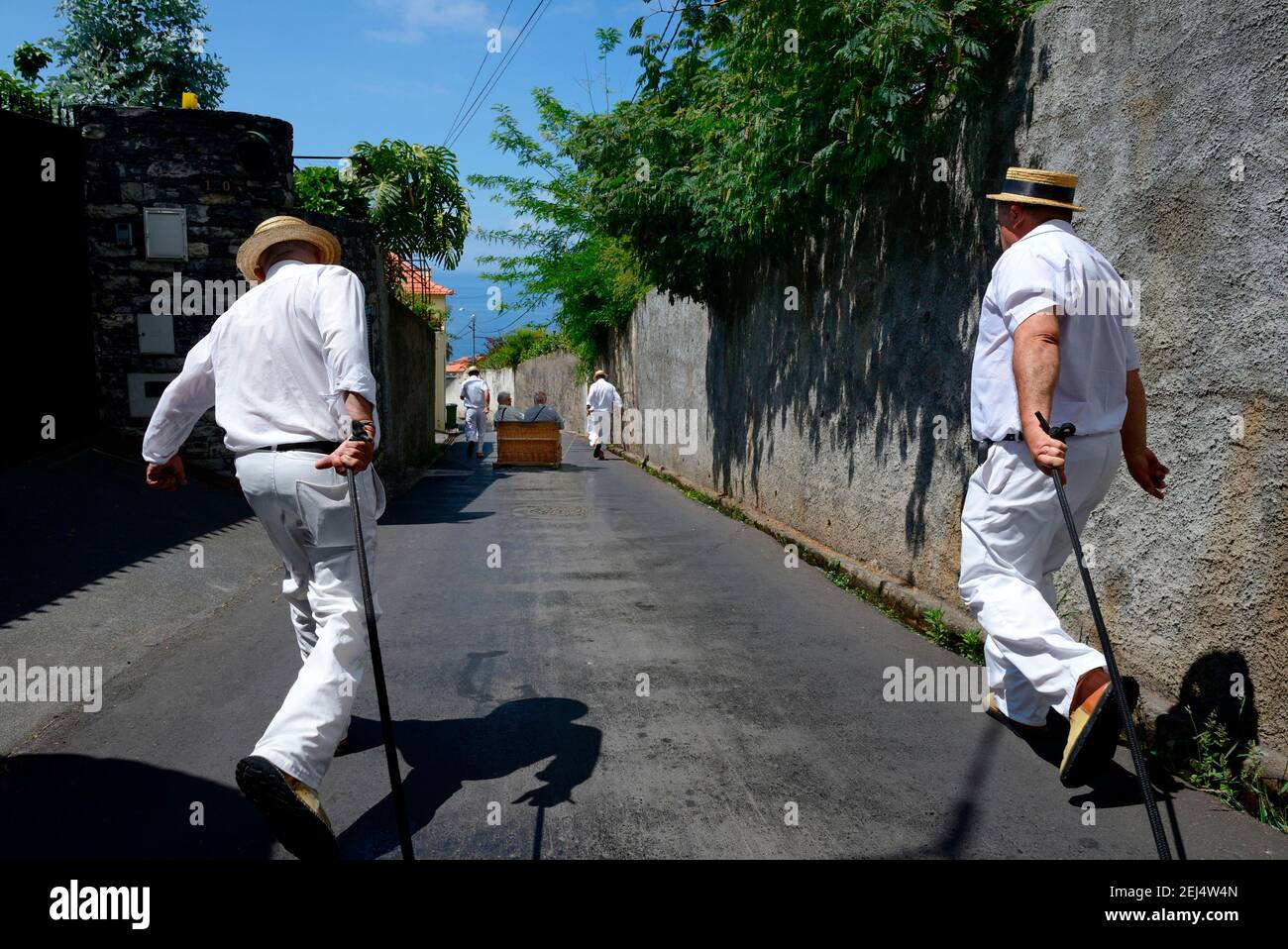Ride with the basket sledge, men pull and push basket sledge, Monte ...