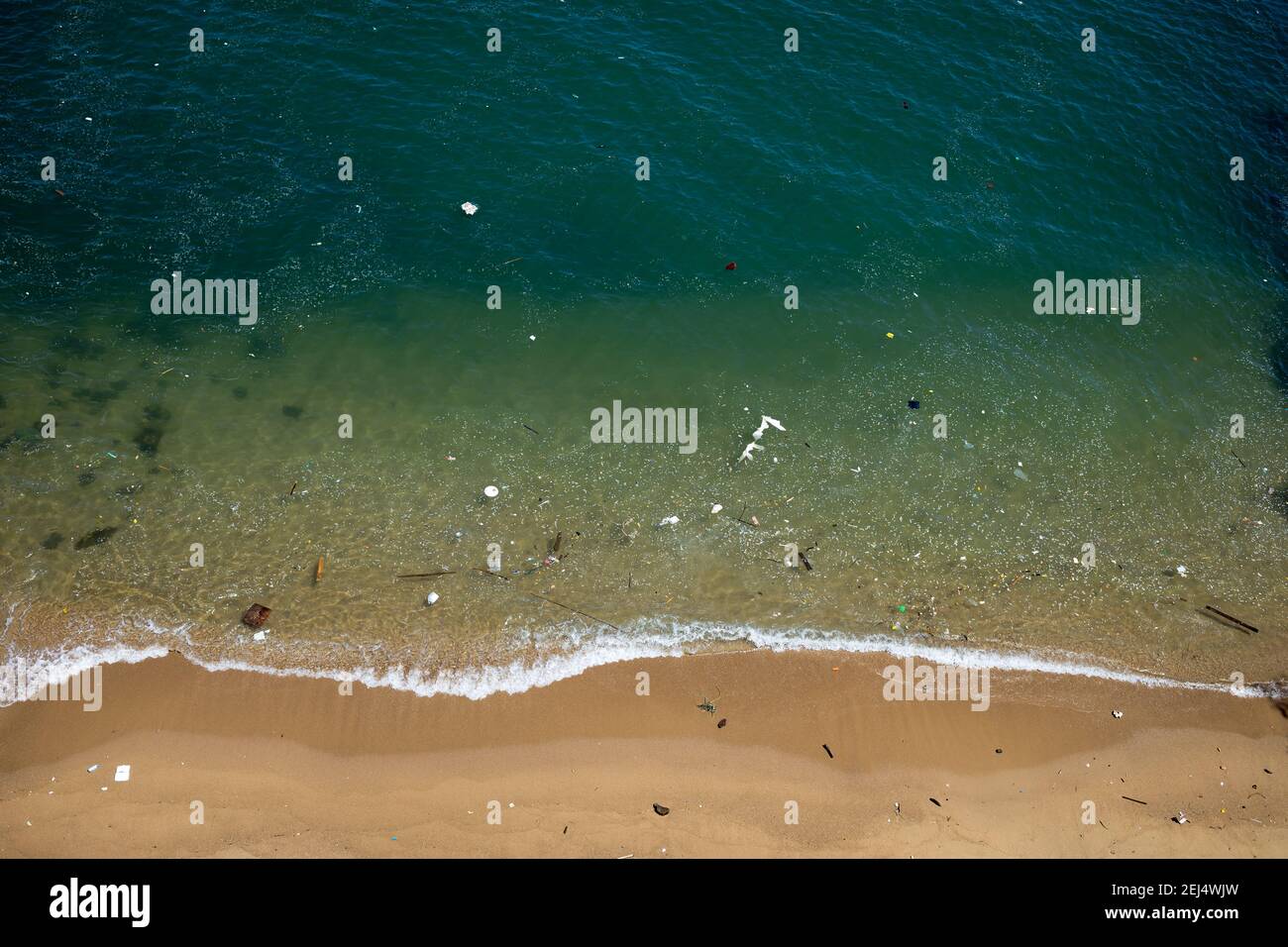a lot of garbage floating polluted coastal beach Stock Photo - Alamy