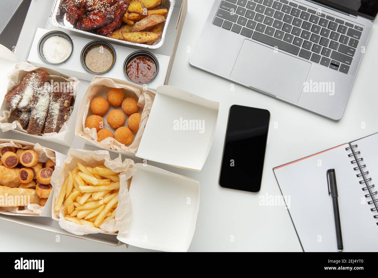 Set of fried fast food in cardboard box, sauce and ketchup in ...