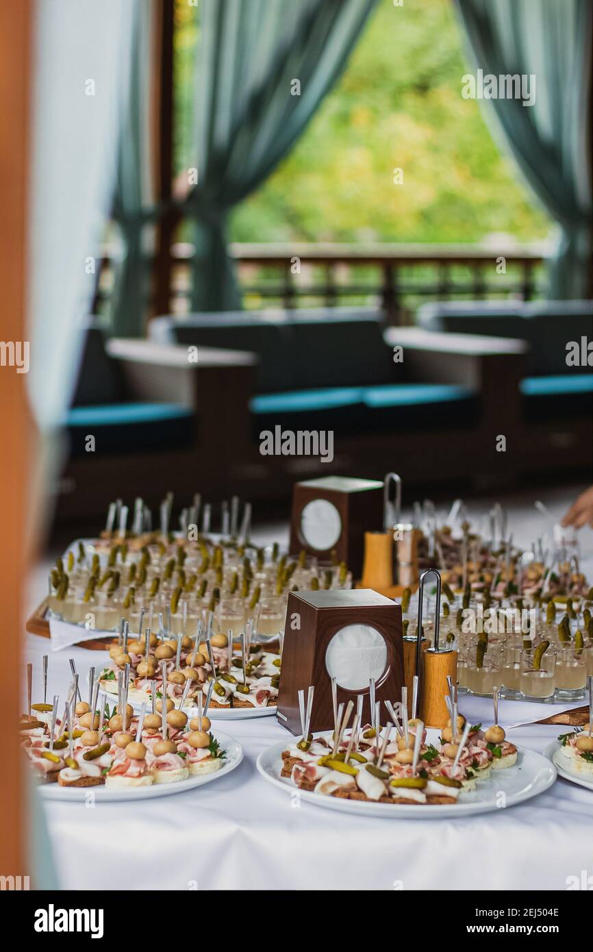 Catering table set service at restaurant before party Stock Photo - Alamy