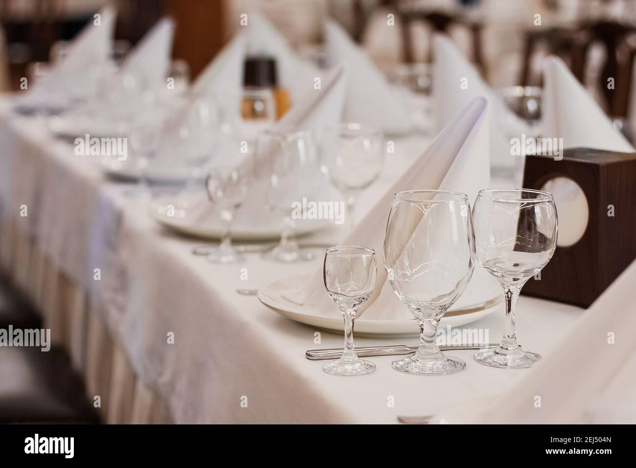 Catering table set service at restaurant before party Stock Photo - Alamy