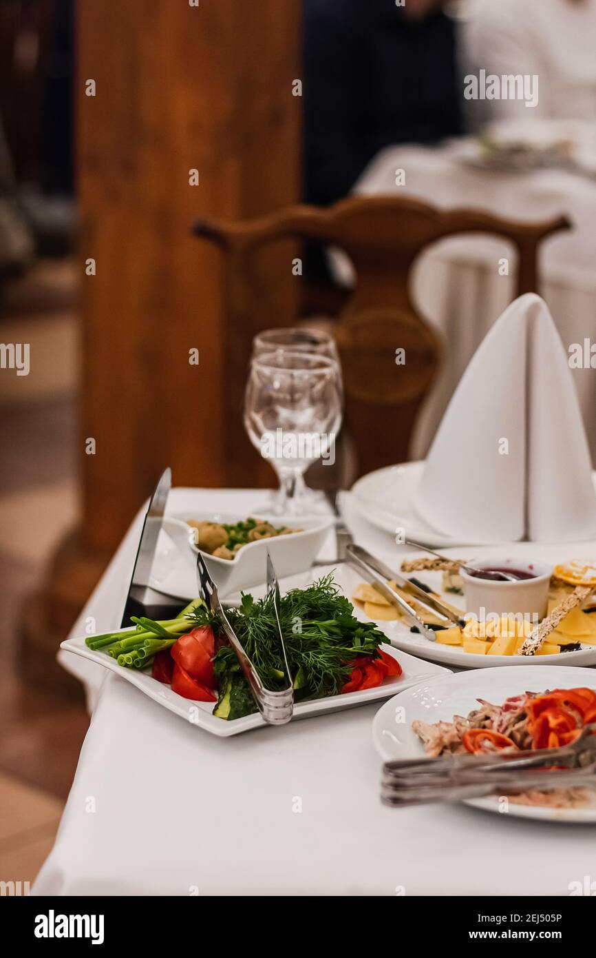 Catering table set service at restaurant before party Stock Photo - Alamy