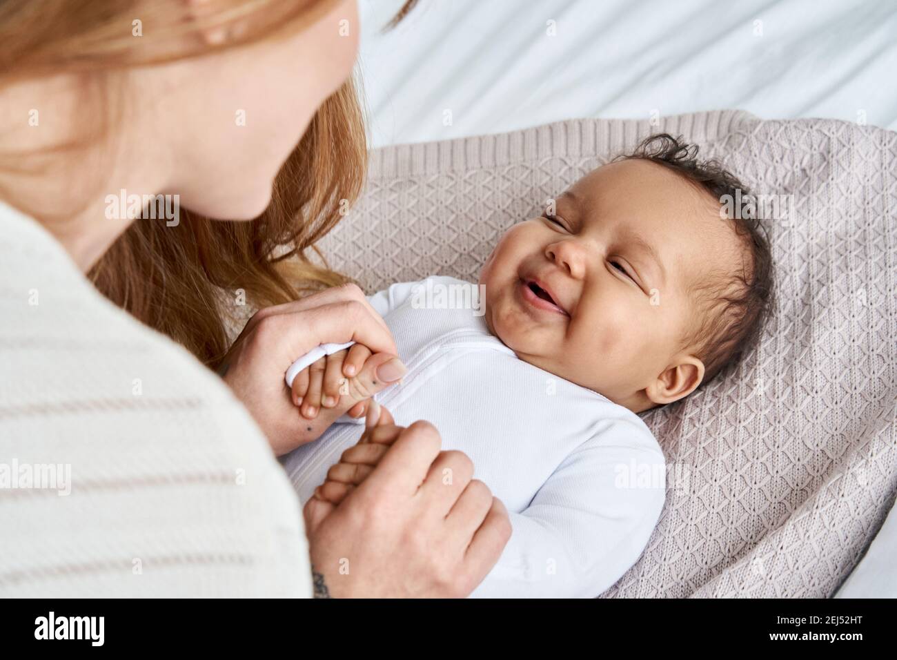 Black mom holding infant hi-res stock photography and images - Alamy