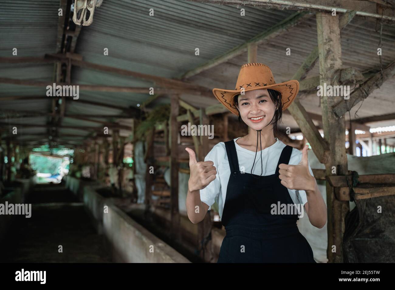 Asian woman wearing cowboy hat hi-res stock photography and images - Alamy