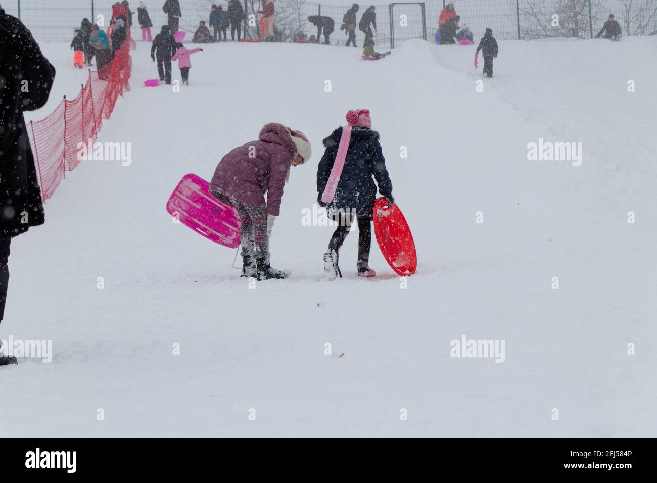 Snowfall. Children playing on snow in winter time. Cute children ...