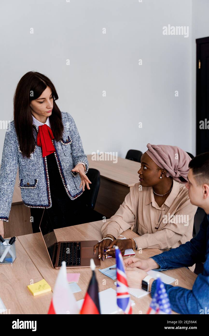 Teamwork. Working in multiethnic group of students. teacher study ...