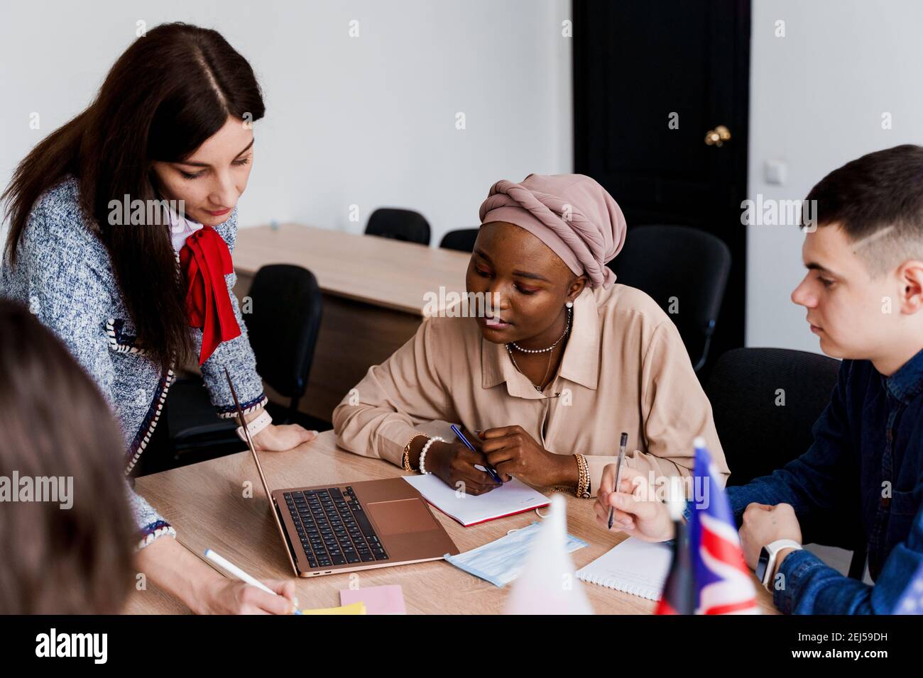 Teamwork. Working in multiethnic group of students. teacher study ...