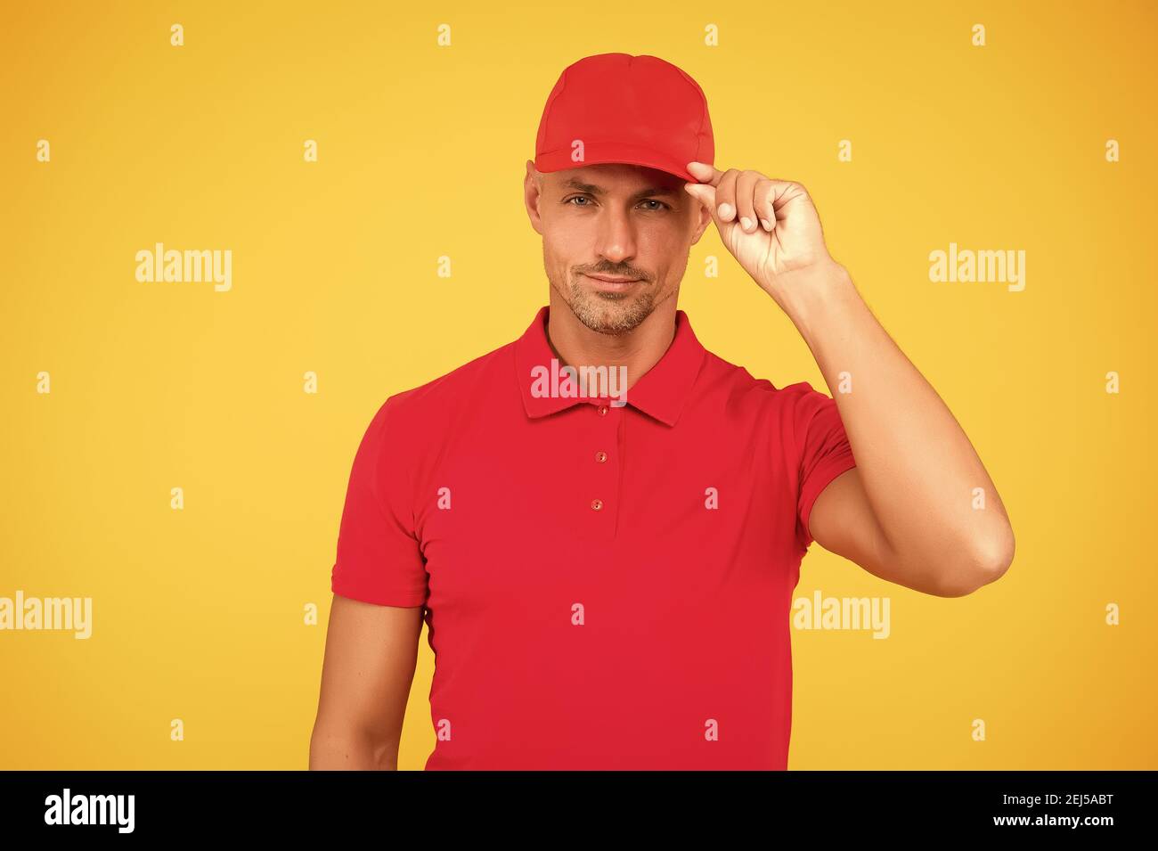 Keep it casual. Serious man wear red cap yellow background. Handsome ...