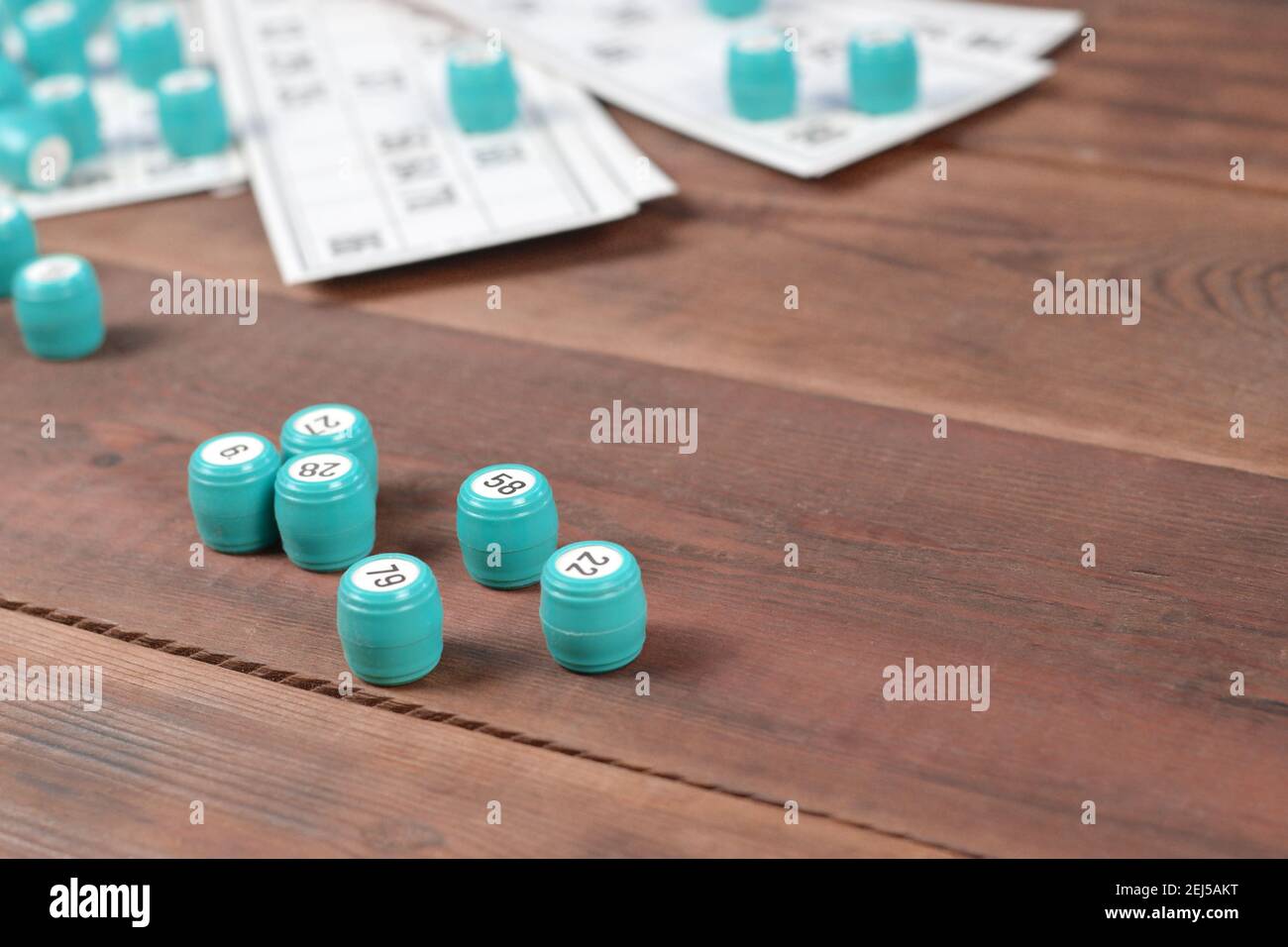 Many barrels with numbers and cards for lotto or russian bingo table ...