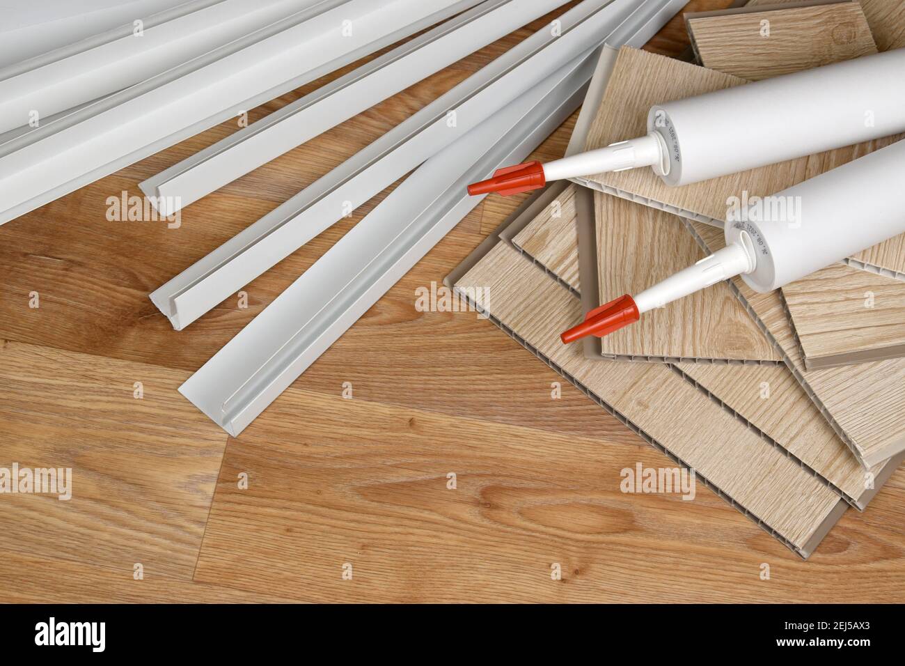 Set of items for PVC ceiling indoor works. Assembly adhesive bottles ...