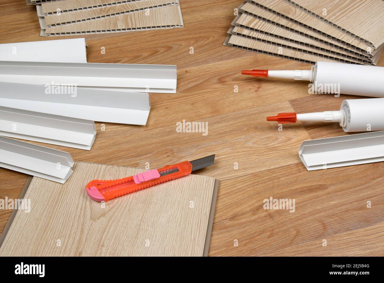 Set of items for PVC ceiling indoor works. Assembly adhesive bottles ...