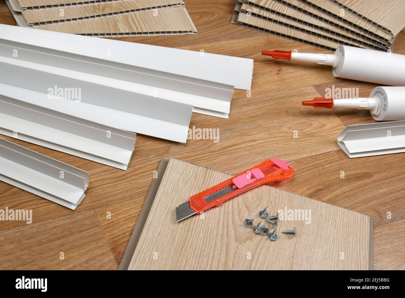 Set of items for PVC ceiling indoor works. Assembly adhesive bottles ...