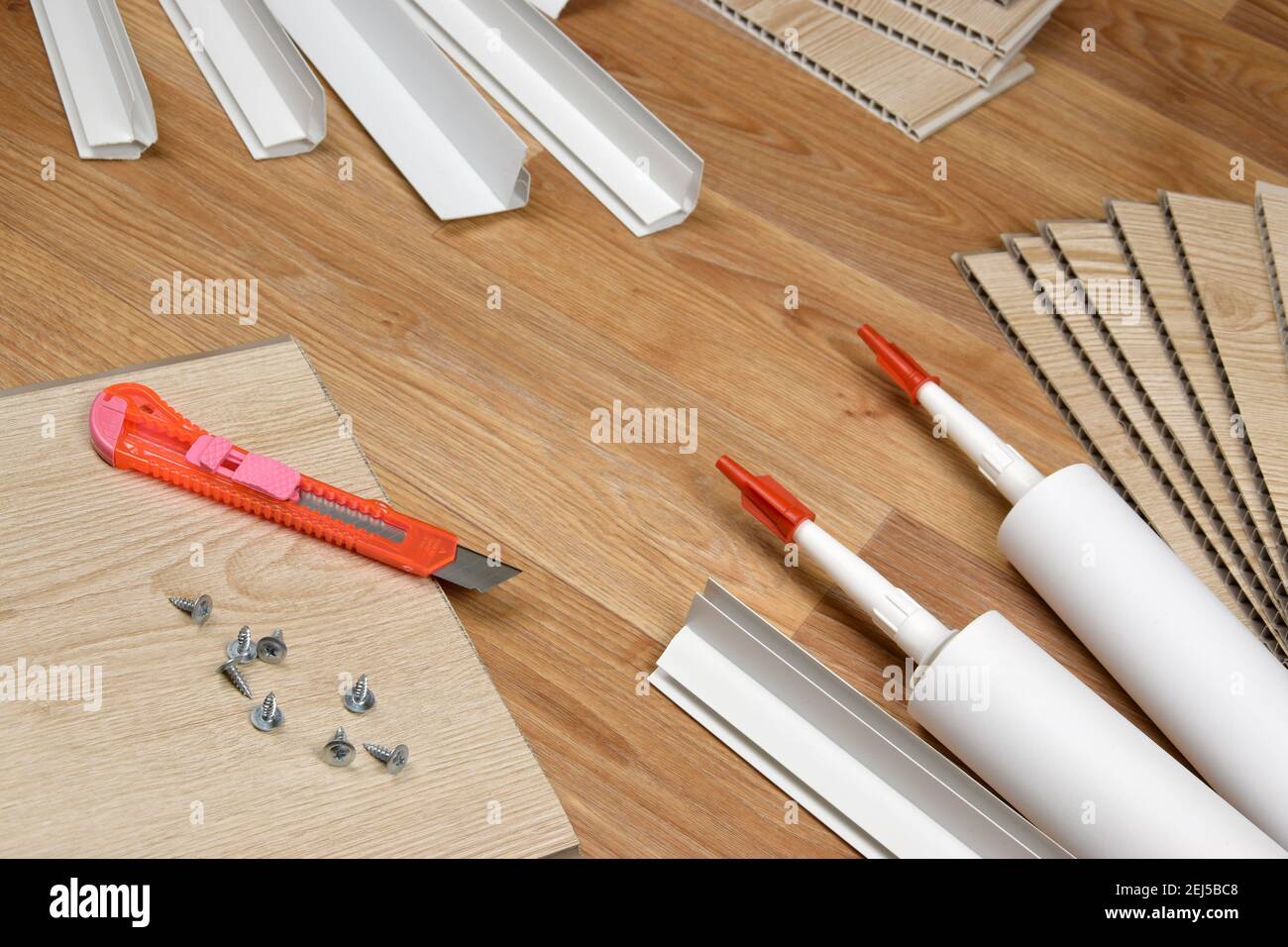 Set of items for PVC ceiling indoor works. Assembly adhesive bottles ...