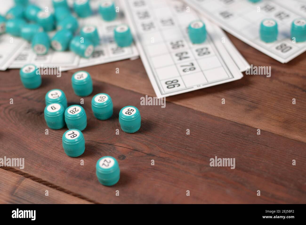 Many barrels with numbers and cards for lotto or russian bingo table ...
