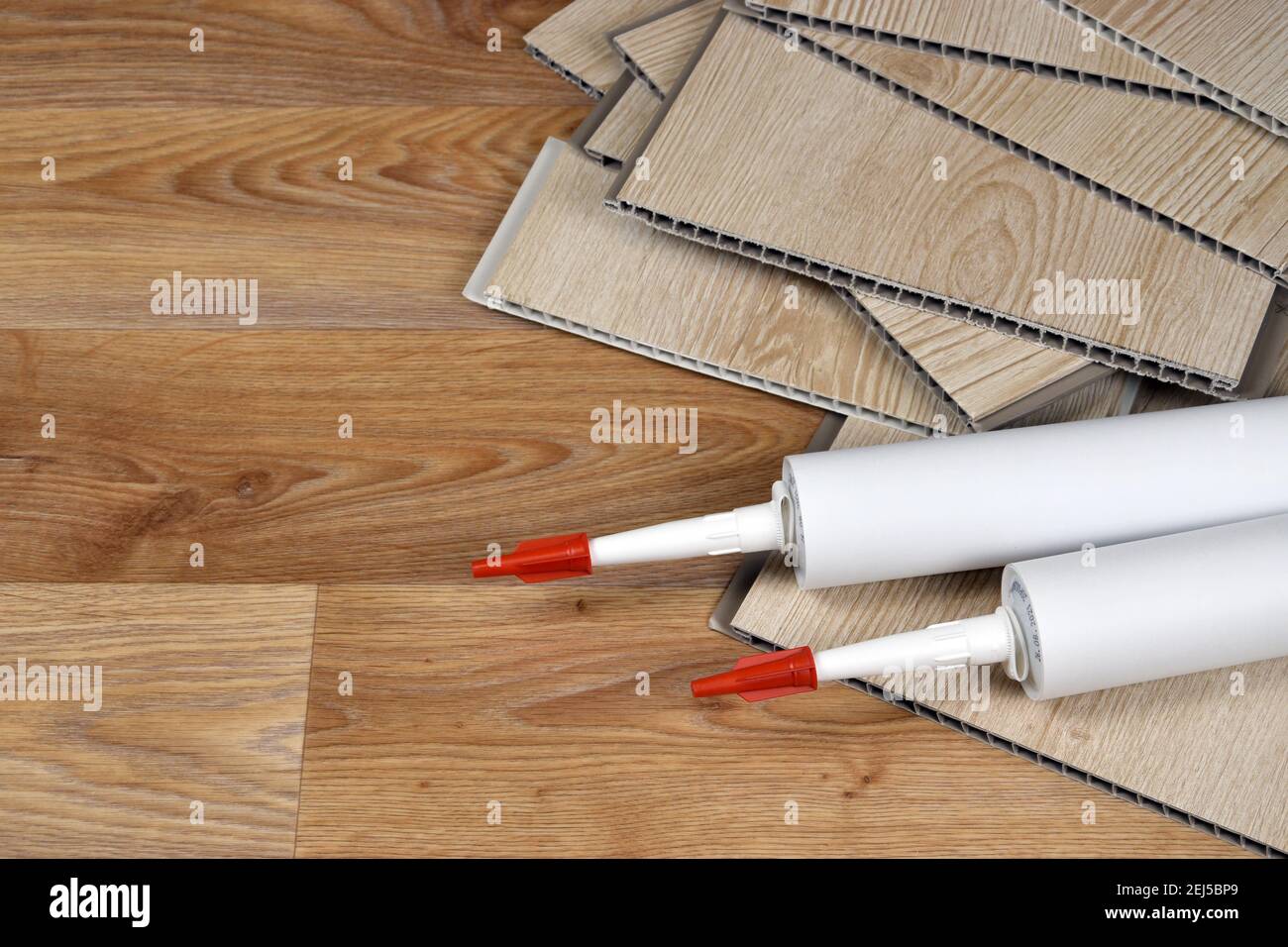 Set of items for PVC ceiling indoor works. Assembly adhesive bottles ...