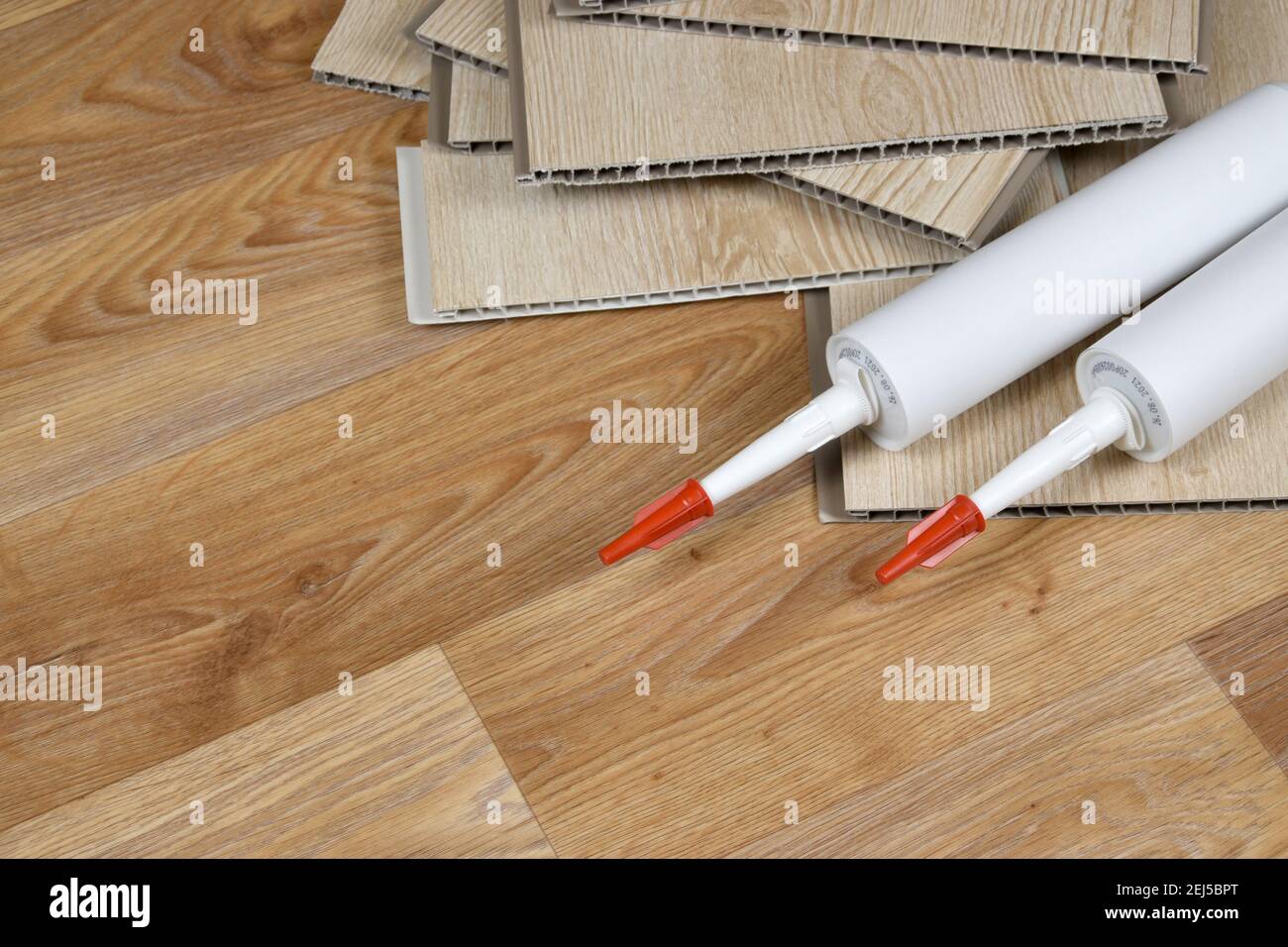 Set of items for PVC ceiling indoor works. Assembly adhesive bottles ...