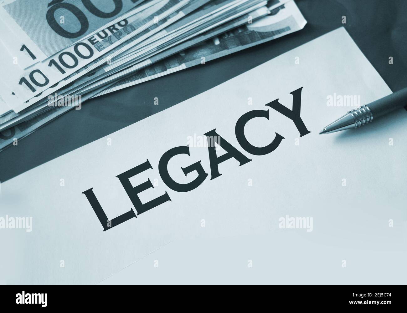 Legacy word on page, pen and hundred Euro bills. Last will legal ...