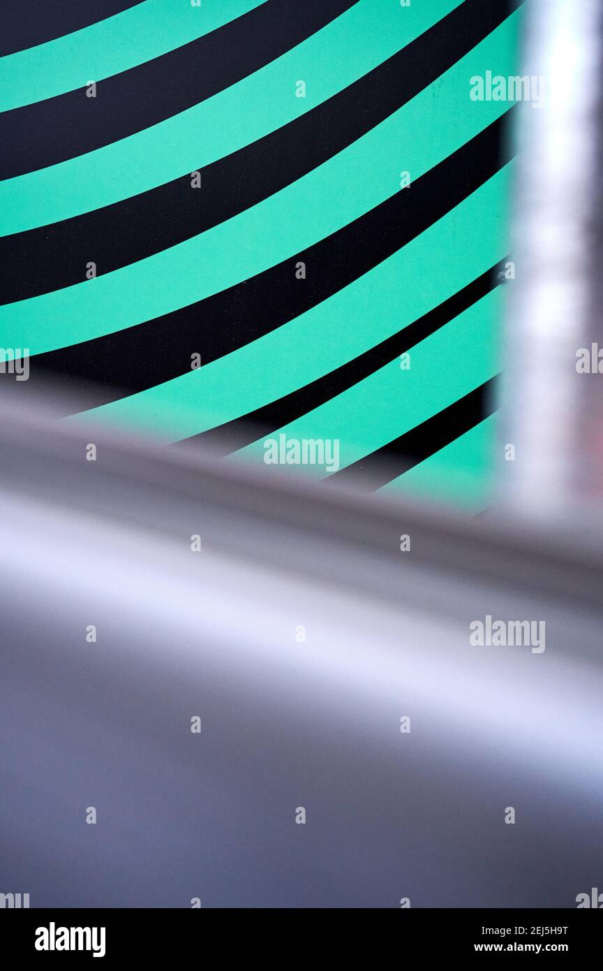 Random curved green and black curved stripe patterns above blurred ...