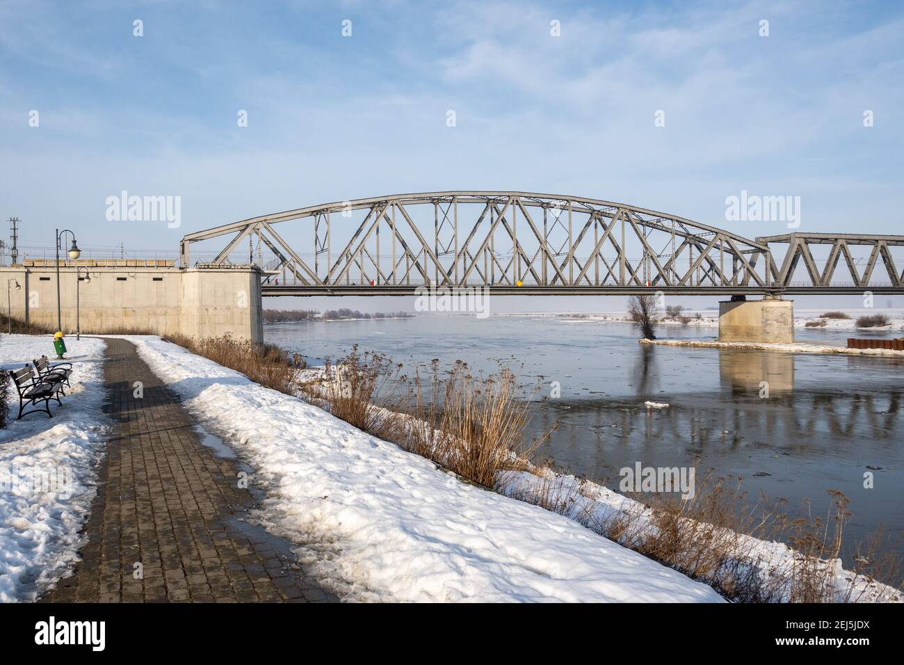 Vistula riverbank promenade in Tczew. The historic bridge in background ...