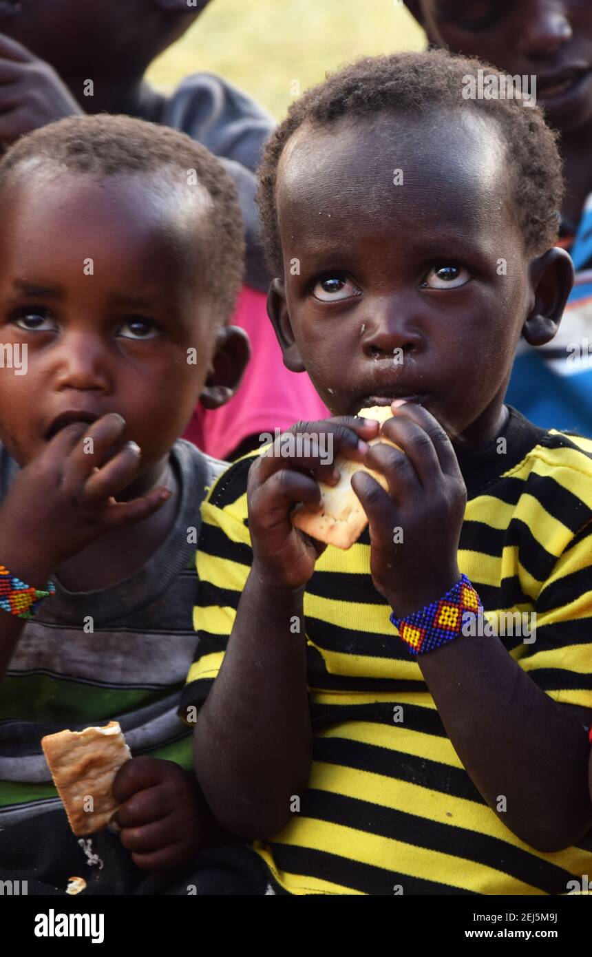 Group of unknown children from a Masai tribe in Kenya Stock Photo - Alamy