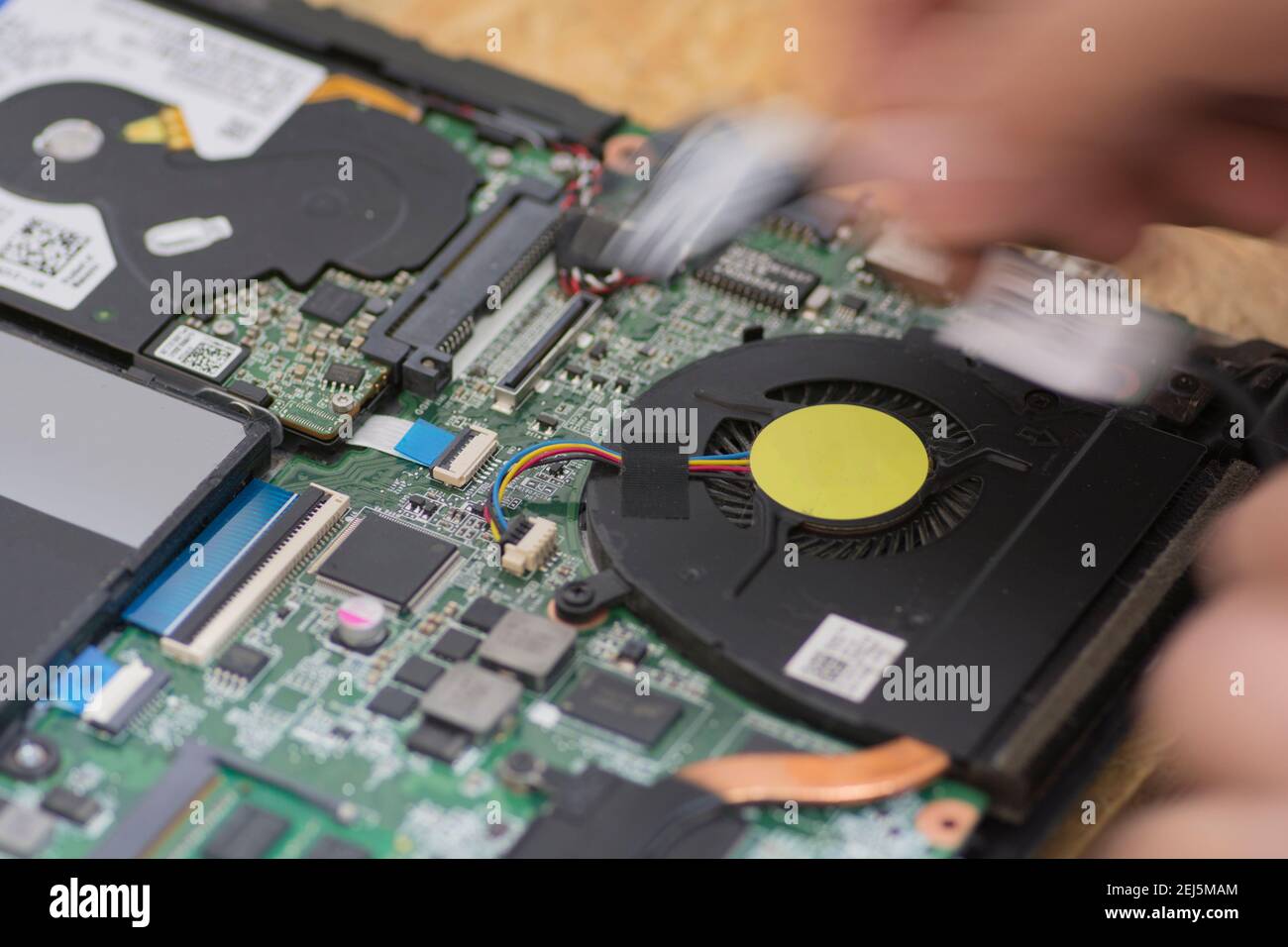 Technician repairing a laptop motherboard Stock Photo - Alamy