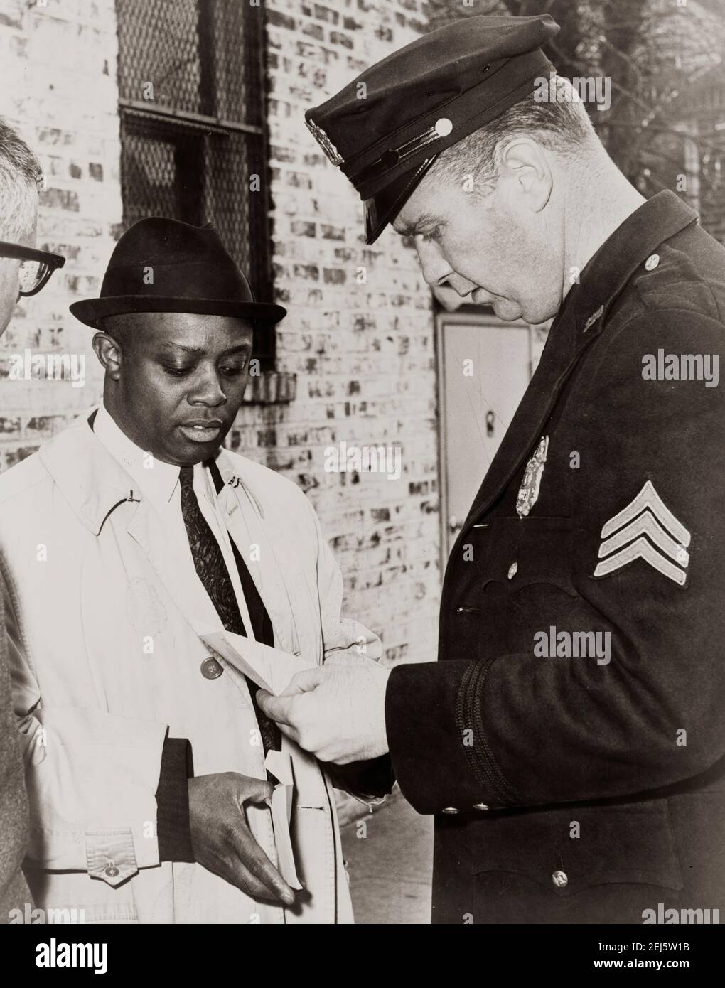 Joseph X- a follower of the late Malcolm X - talking to NYPD officer ...