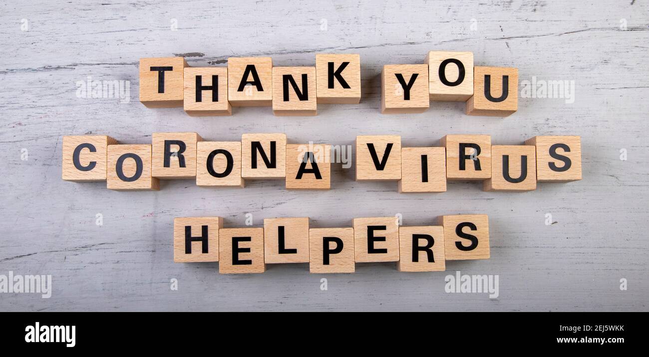 wooden blocks in a white and grey board with the text thank you corona ...