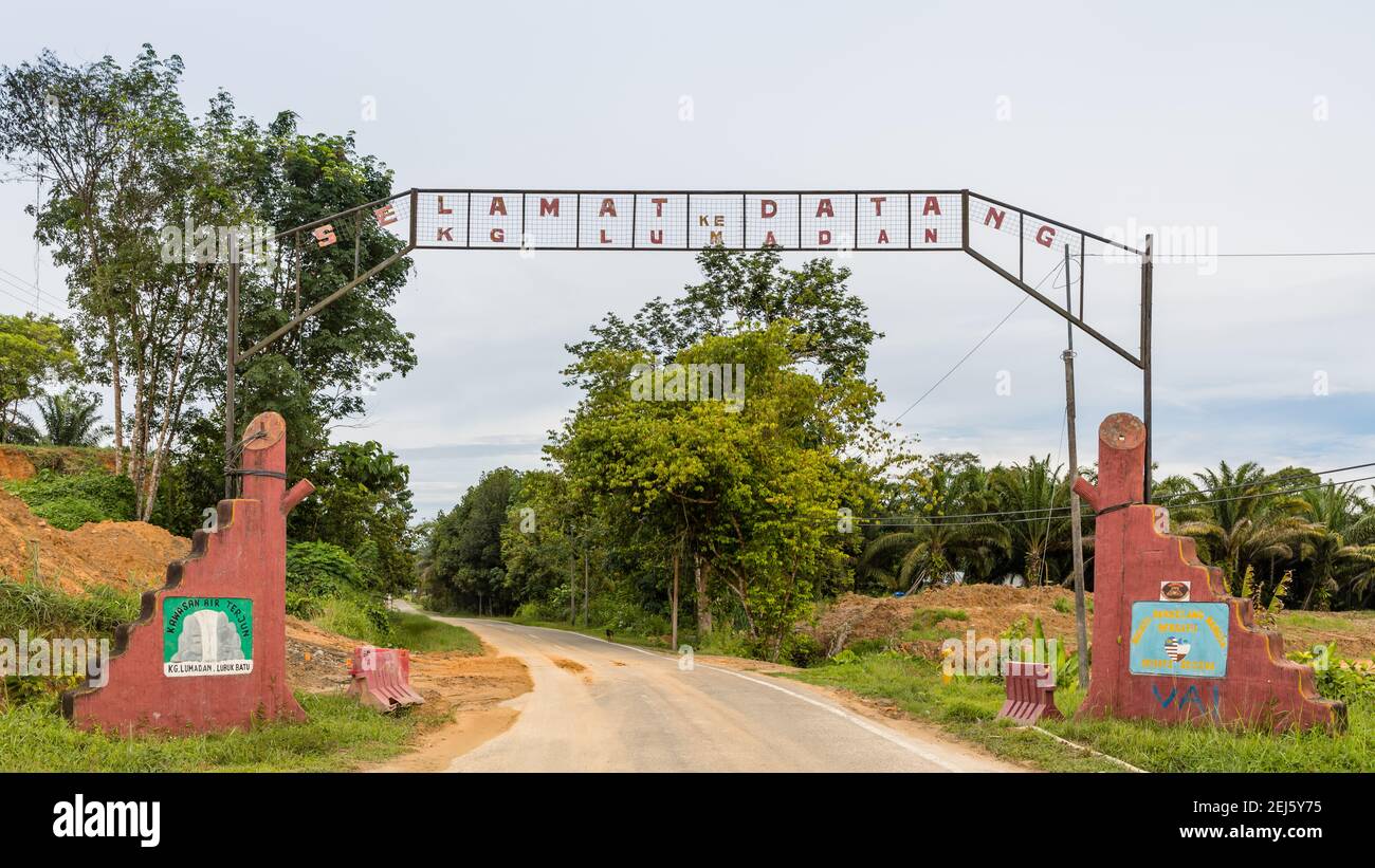 Village gate of Lumadan, Sabah, Malaysia, with uprooted area - short ...