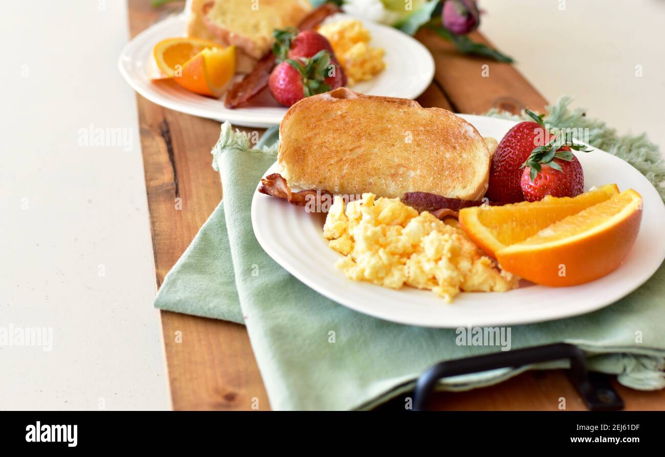 Traditional style American breakfast arranged on tray for hotel room ...