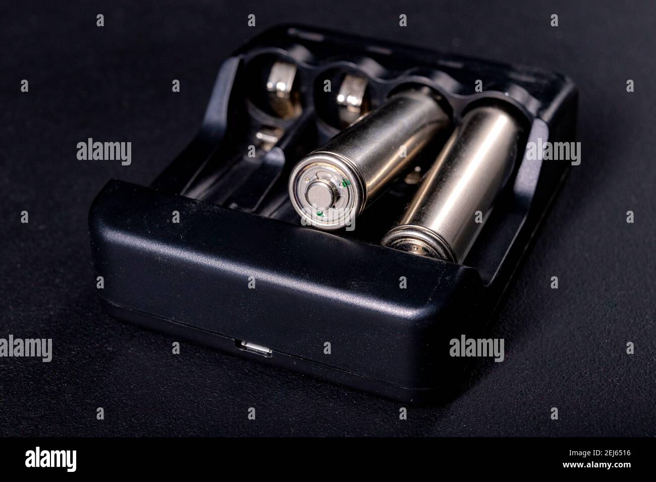 Electric battery charger on the table. Accessories for powering home ...