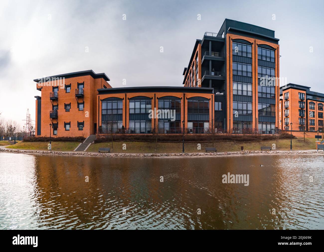 Lodz, Poland - February 22 2020 Facade of high red brick apartment ...