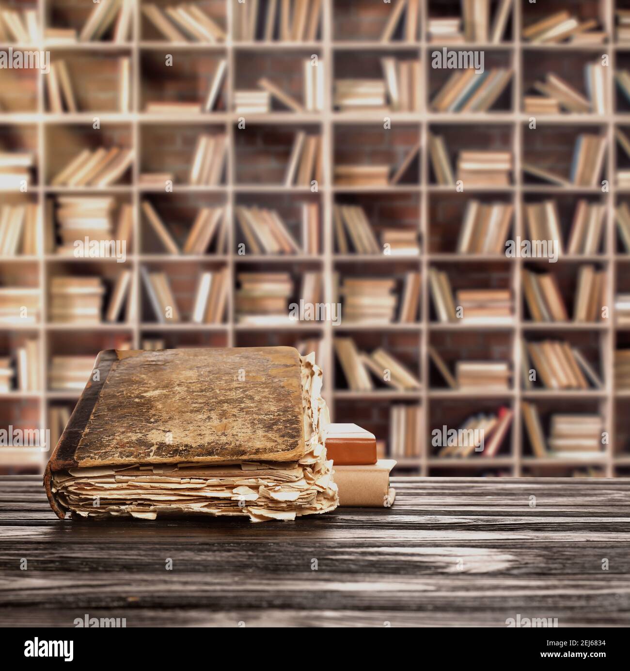 Old books on table in library Stock Photo - Alamy