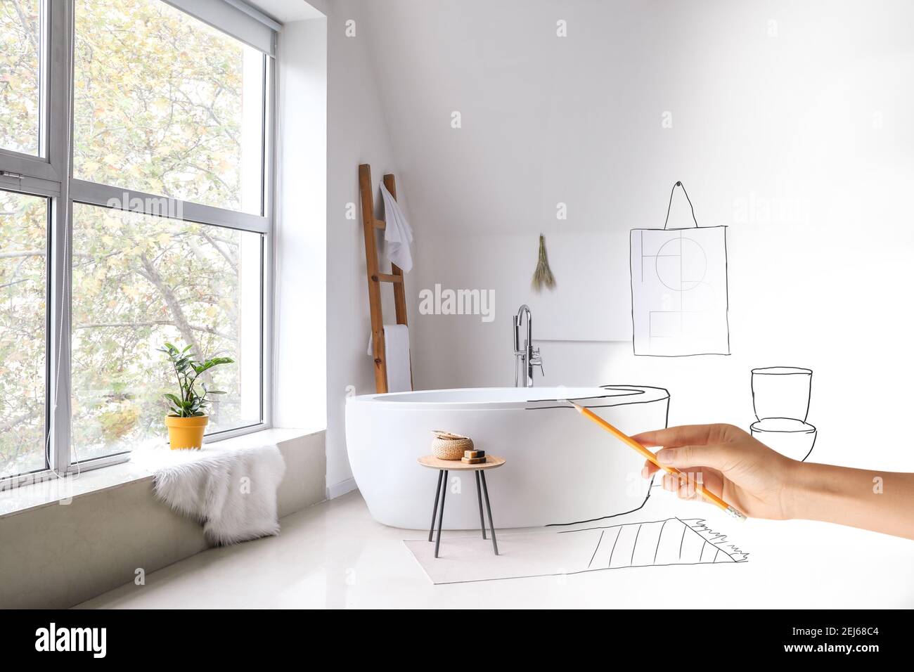 Designer drawing new interior of bathroom Stock Photo - Alamy