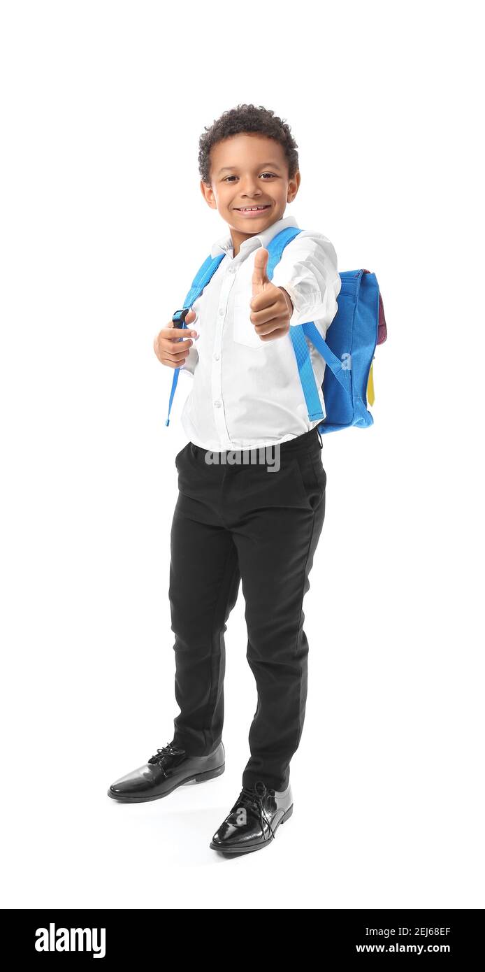 Little African-American schoolboy showing thumb-up gesture on white ...