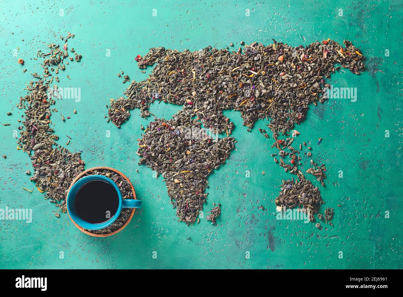 World map made of green tea and cup on color background Stock Photo - Alamy