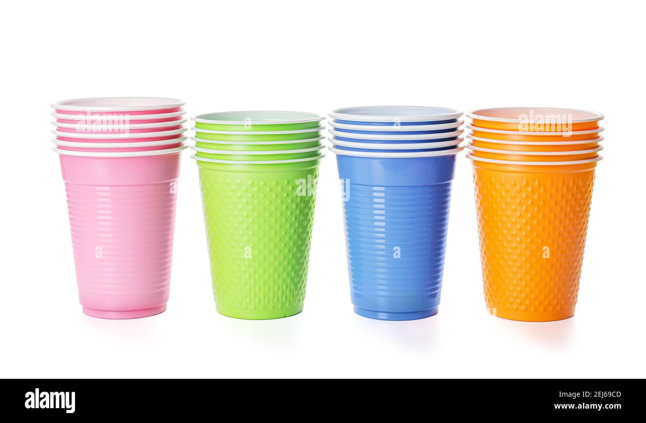 Plastic cups on white background Stock Photo - Alamy
