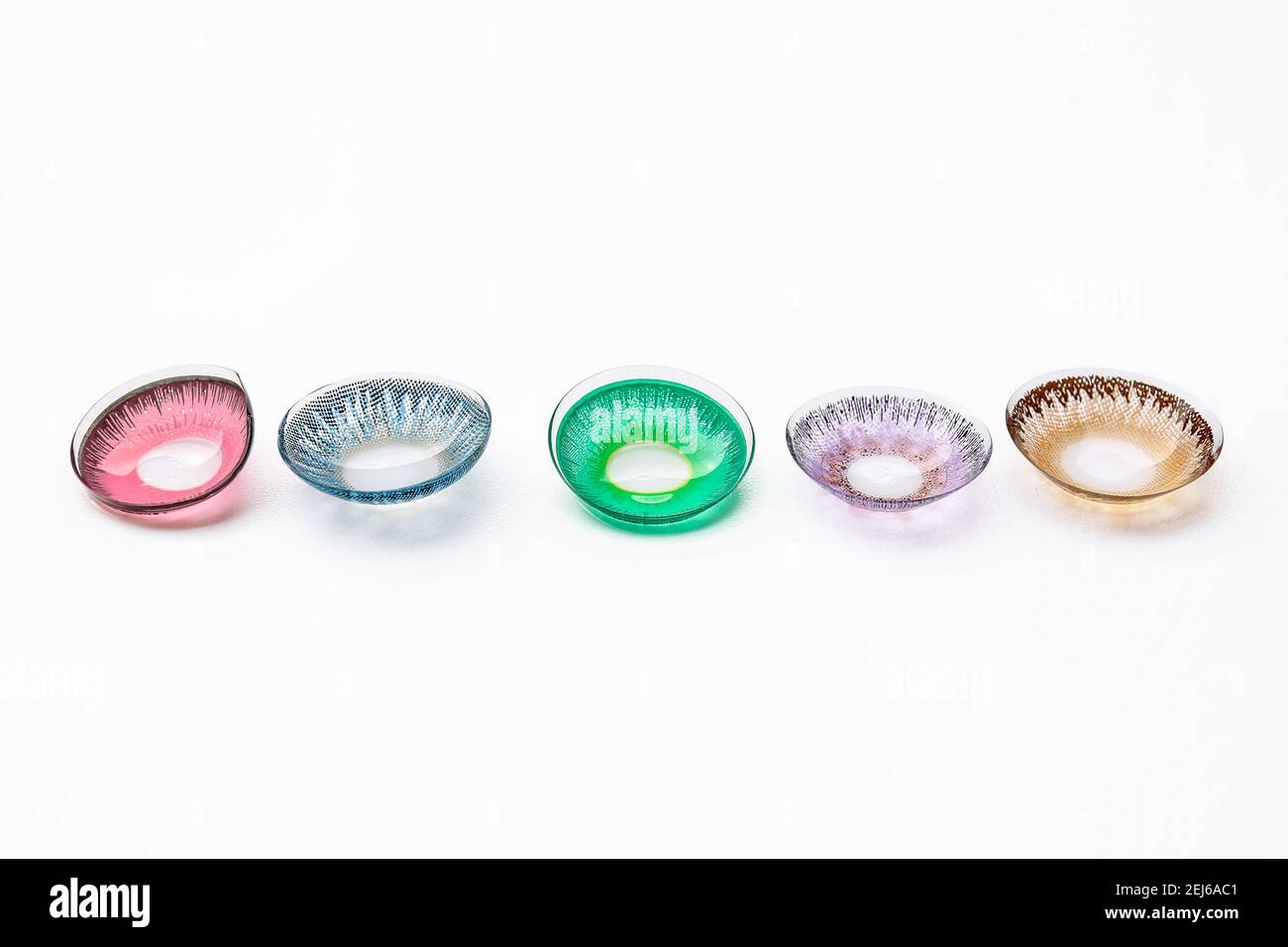 Different contact lenses on white background Stock Photo - Alamy
