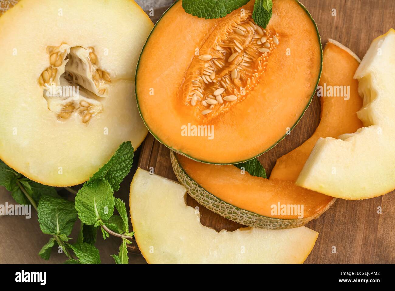 Board with sweet cut melon, closeup Stock Photo - Alamy