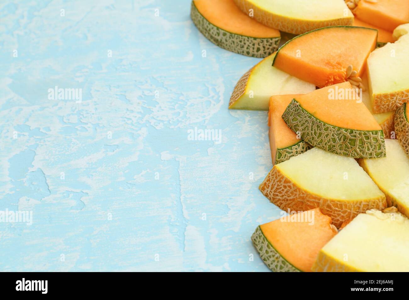 Sweet cut melon on color background Stock Photo - Alamy