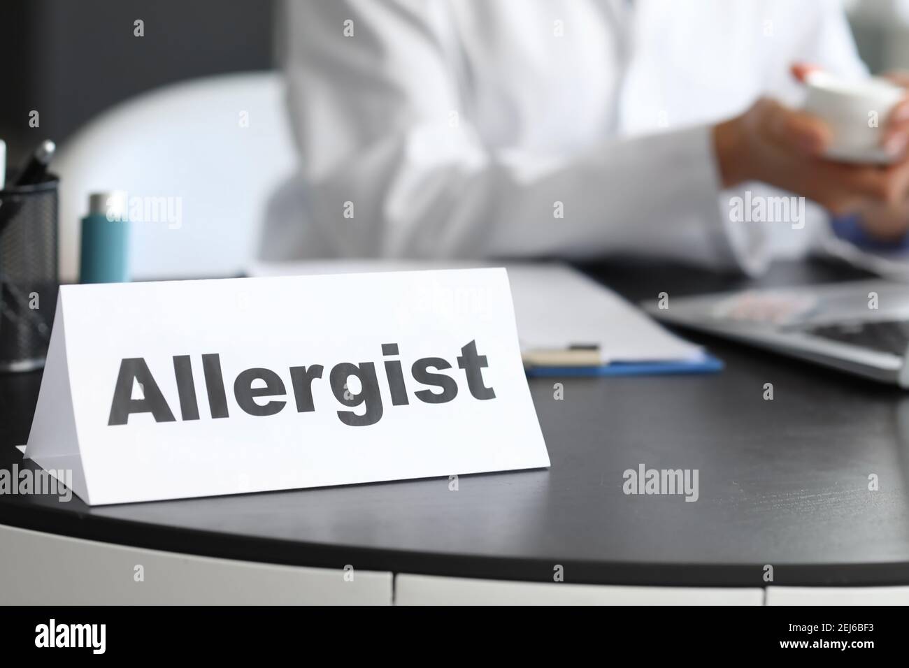 Paper with word ALLERGIST on table in clinic Stock Photo - Alamy