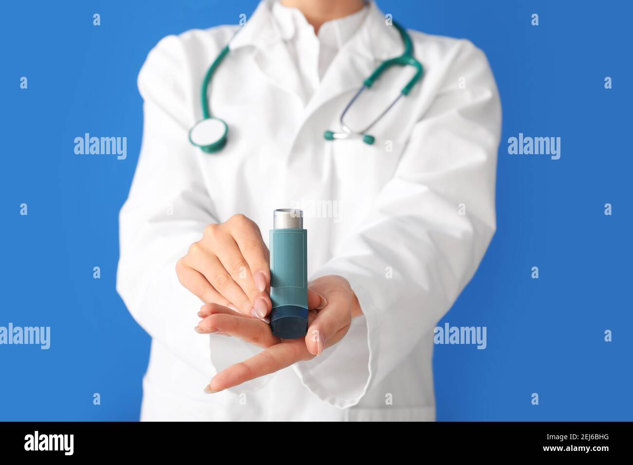 Allergist with inhaler on color background, closeup Stock Photo - Alamy