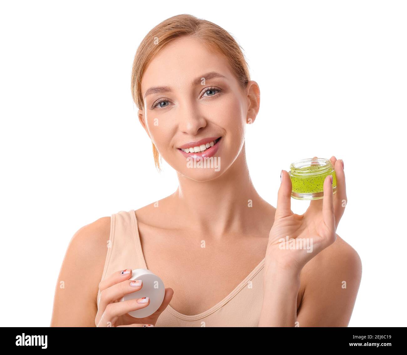 Beautiful young woman with cosmetic product on white background Stock ...