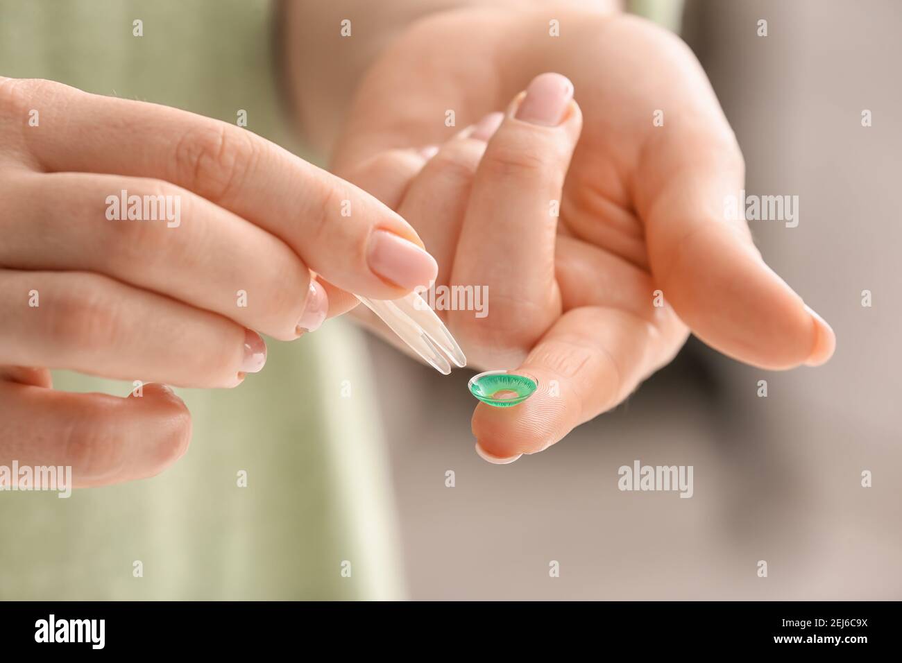 Female hand tweezers contact hi-res stock photography and images - Alamy