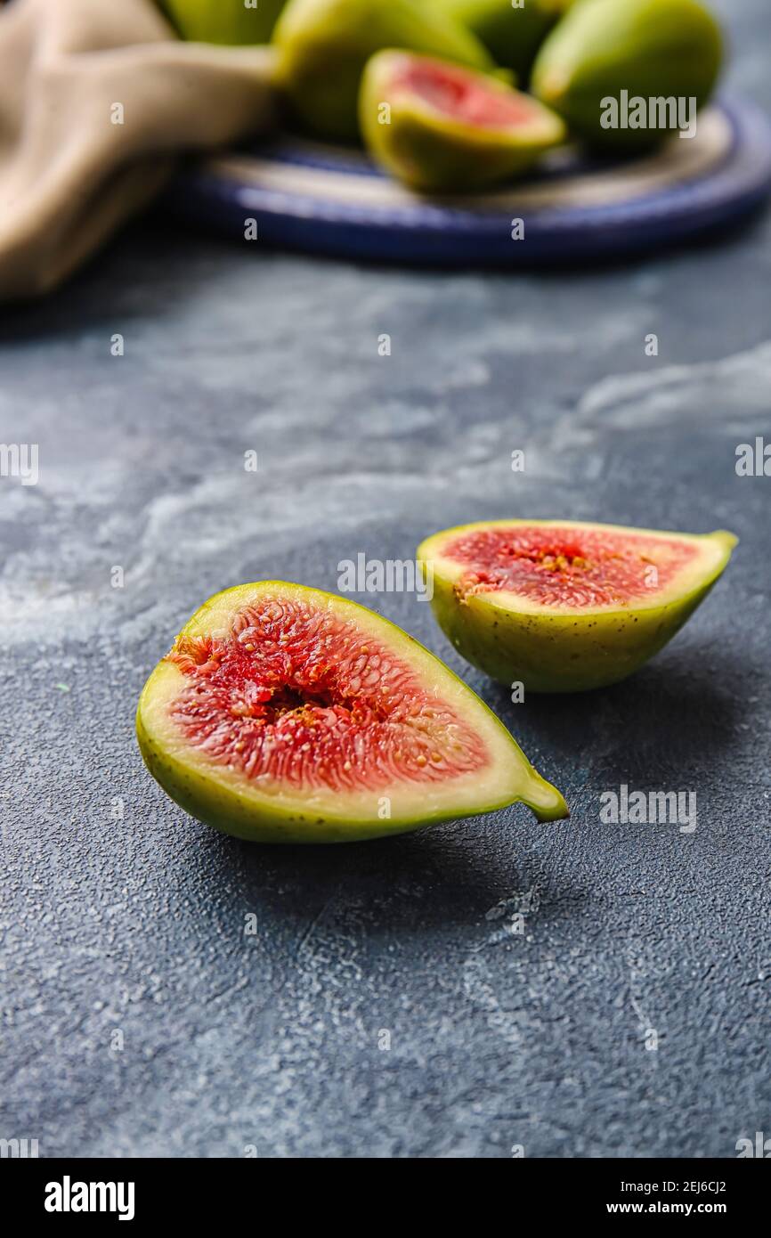 Fresh green figs on color background Stock Photo - Alamy