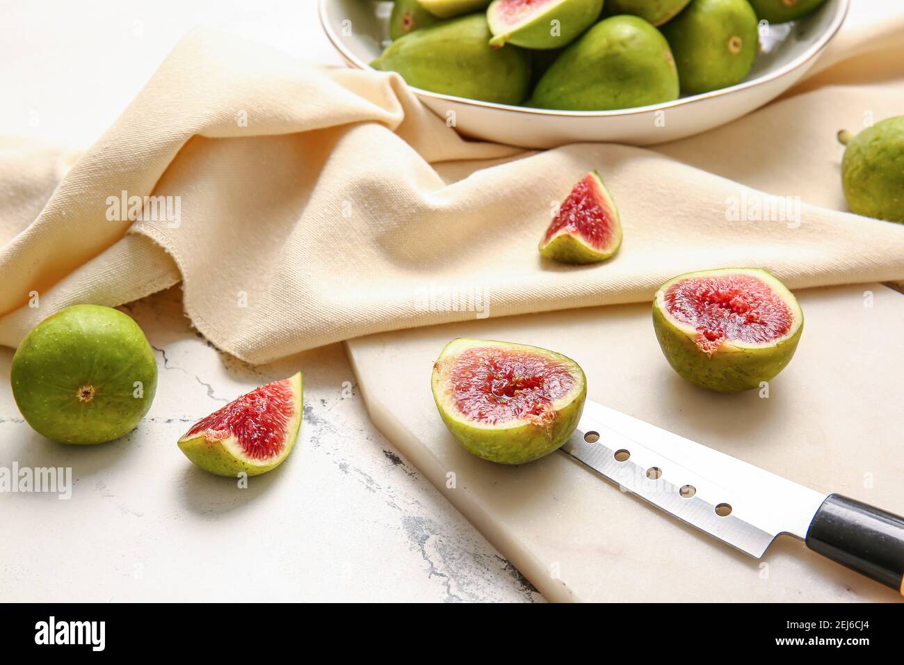 Fresh green figs on light background Stock Photo - Alamy